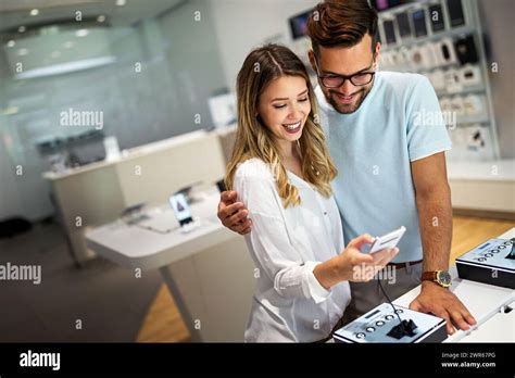 Tech Shopping Device Gadget Concept Happy Young People Buying A New