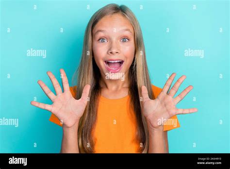 Close Up Photo Of Cheerful Overjoyed Girl Stylish Clothes Showing Arm