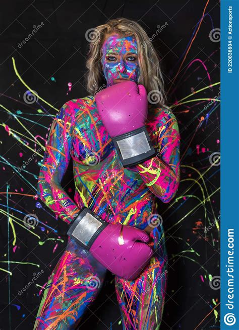Naked Female Is Being Painted With Colorful Paint In A Home Environment