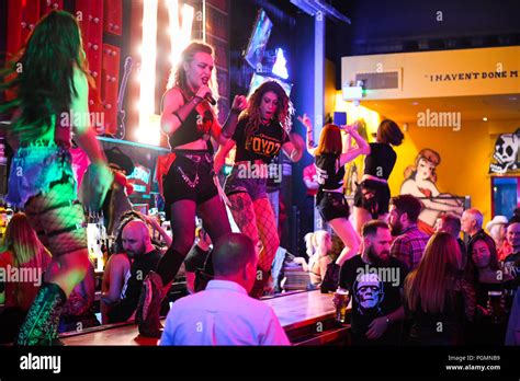 Inside A Coyote Ugly Bar Where Women Dance On The Bar As People Order