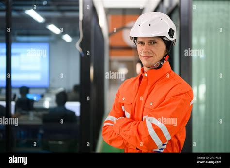 Engineer Working And Solving Problems On Machine At Industrial Plant