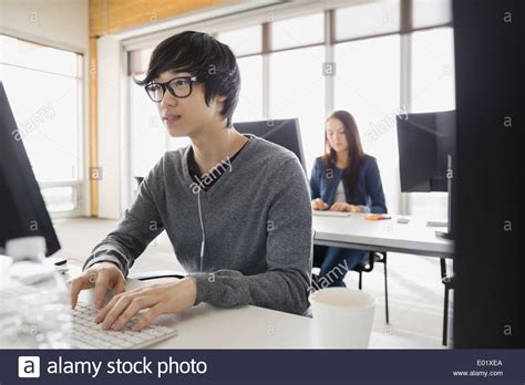 Two Women Using Computer Lab Hi Res Stock Photography And Images Alamy