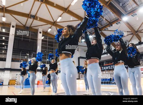 Low Angle Shot Of Cheerleaders During A Dance With Their Hands In The