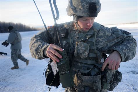Army Pfc Ryan Pepp Prepares A Radio As Fellow Soldiers Train With The M110 Sass And M107 50