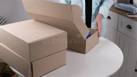 Unrecognizable Woman Packing Clothes In Boxes Stock Video Video Of Occupation Product 296186127