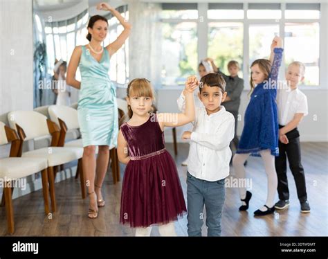 Preteen Pupils Rehearsing Ballroom Dance For Festive School Event Stock