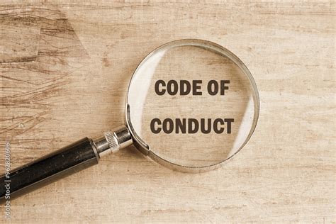 Code Of Conduct Symbol Business And Code Of Conduct Concept Copy Space Through A Magnifying