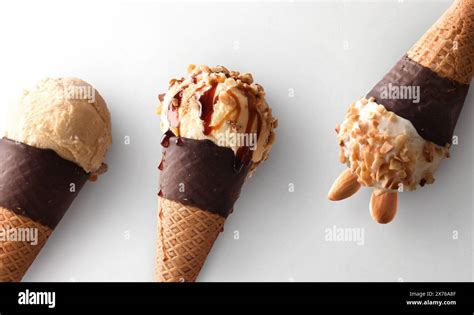 Detail Of Three Ice Cream Cones Of Various Flavors With Chocolate Cones