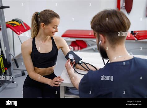 Female Athlete Undergoes An Exercise Tolerance Test With A Cardiologist