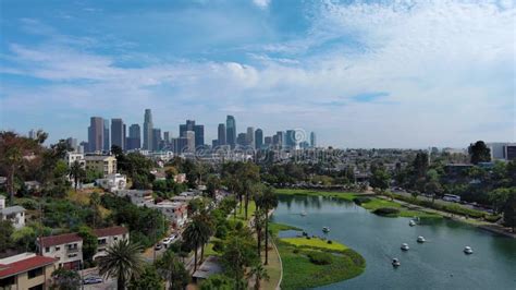 Sideways Aerial Footage Of Echo Park Lake With People In Pedal Boats