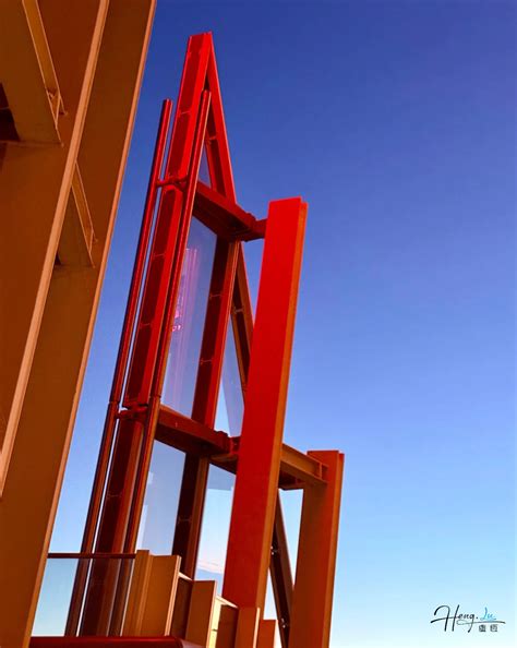 A Bold Red Structure Against The Evening Sky Henglu