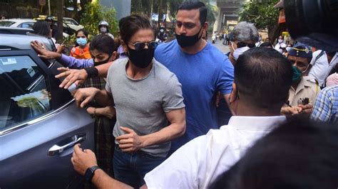 In Pics Shah Rukh Khan Mobbed By Paparazzi As He Visits Son Aryan Khan