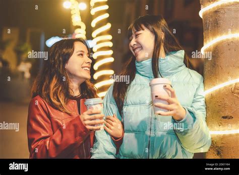 Happy Friends Walking In City While Drinking Coffee Young Girls