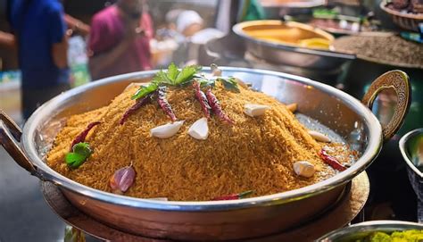 A Bustling Street Food Vendor Selling Biryani Rice With Colorful Spices