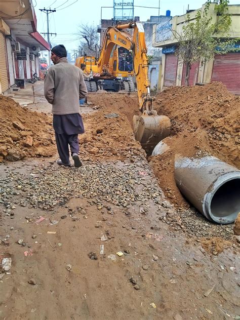 Excavator Dig The Trenches At A Construction Site Trench For Laying