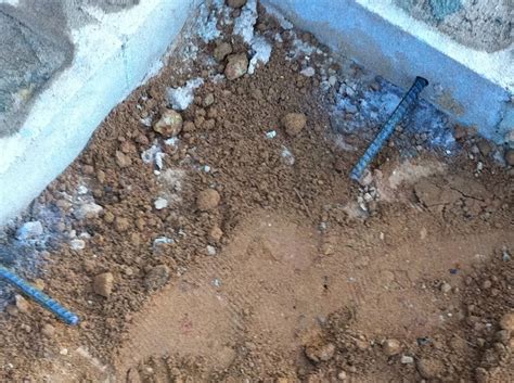 Rebar Dowels Installed In The Block Wall With Epoxy To Help The Slab