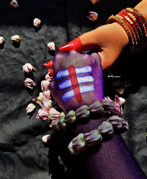 Purple And Red Object In Womans Hand