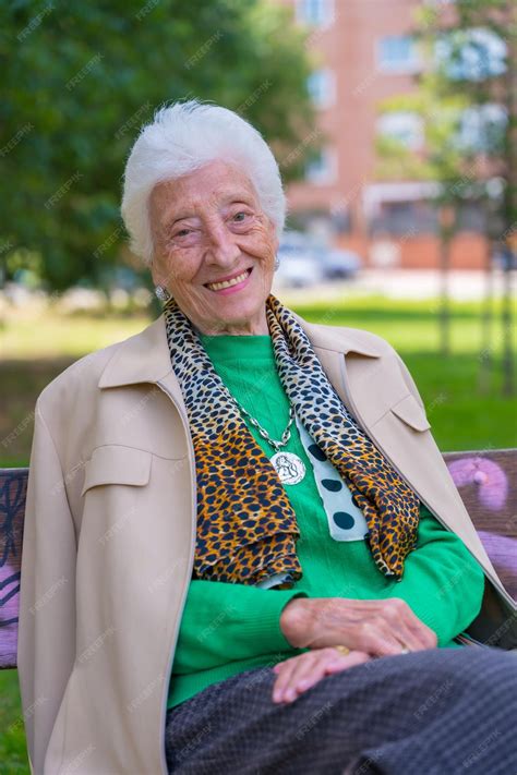 Premium Photo Portrait Of An Elderly Woman Sitting On A Chair In The