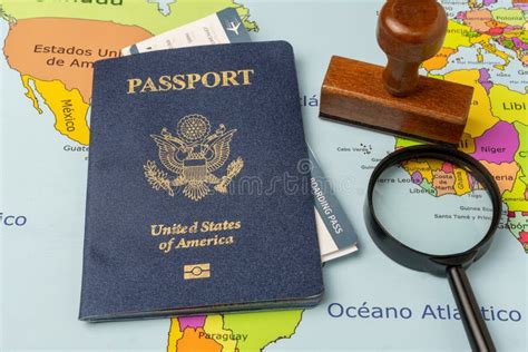 Us Passport Stamp Airplane And Magnifying Glass On A Map Of The World