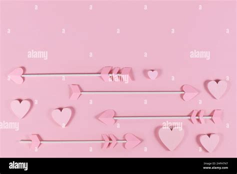 Pink Cupids Arrows With Heart Shaped Tips And Wooden Hart Ornaments