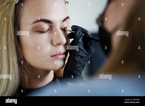 Make Up Artist Applying Eyeshadow On Customer S Eyelid In Salon Stock