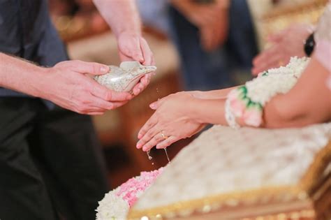 Premium Photo Midsection Of Man Performing Rituals With Bride And