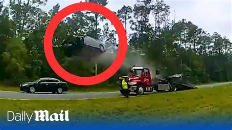 Car Flies 120ft Through The Air After Hitting Tow Truck Ramp At High
