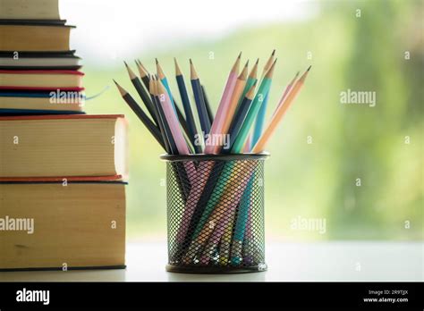 Object Education Green Nature Background With Stack Of Ancient Books Or Old Bible Open Paper