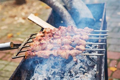 Premium Photo | Barbecue on a pitchfork in the park