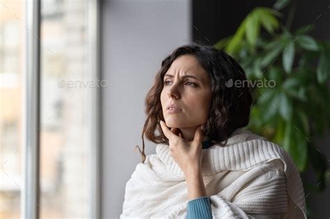 Upset Sick Woman Standing At Home Touching Swollen Neck Glands Having