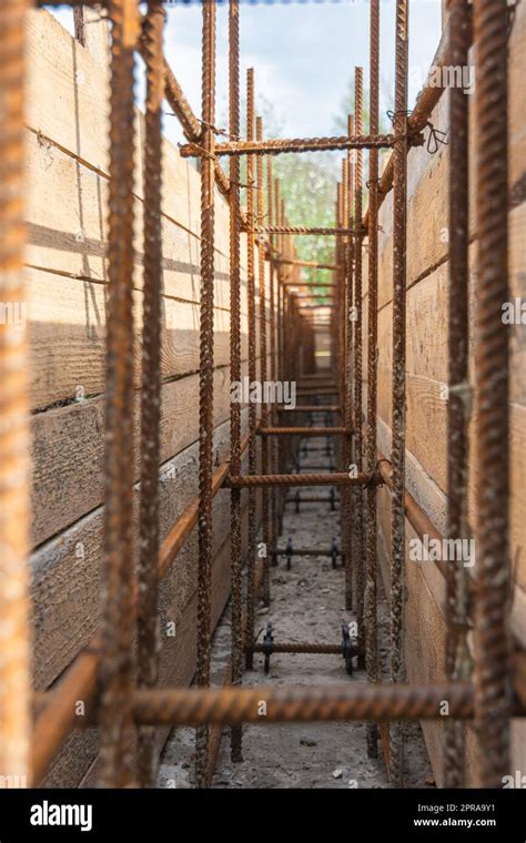 Close Up Of Tied Reinforcement And Mounted Strip Foundation Formwork View Inside The Trench