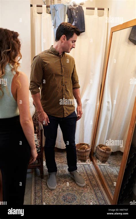 Partner And Man Trying On Clothes In Changing Room Vertical Stock Photo Alamy