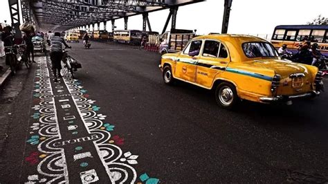 Kolkatas Howrah Bridge Gets Colourful Makeover With Alpana Motifs Ahead Of Durga Puja