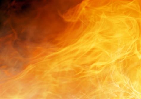 Premium Photo The Image Is Of A Flame With Orange And Yellow Colors