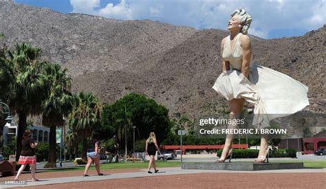 People Visit The Forever Marilyn Statue Of Actress Marilyn Monroe