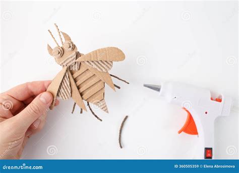Handmade Cardboard Insect Crafts With Crafting Tools On White