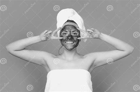 Close Up Beauty Portrait Of A Beautiful Woman With Facial Mud Mask