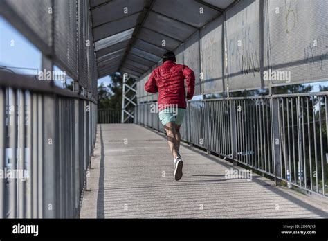 Shot Of A Running Man In The Street Stock Photo Alamy