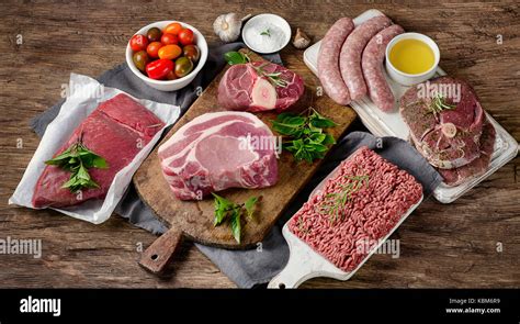 Different Types Of Fresh Raw Meat On A Rustic Wooden Background Top