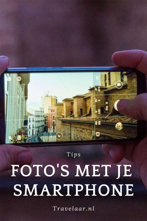 Someone Holding Up Their Cell Phone To Take A Photo With The Text Tips