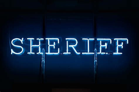 Premium Photo Blue Neon Light Shaped Into The Word Sheriff
