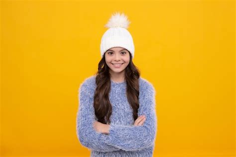 Premium Photo Modern Teen Girl Wearing Sweater And Knitted Hat On
