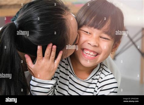 Mother And Her Daughter Playing And Hugging Smiling Mother And Funny
