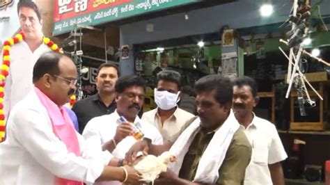 Trs Leader Distributes Chicken Liquor Bottles To Locals In Warangal