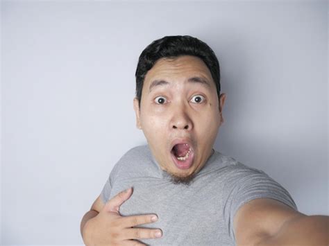 Premium Photo Asian Man Smiling While Taking Selfie Photograph Of
