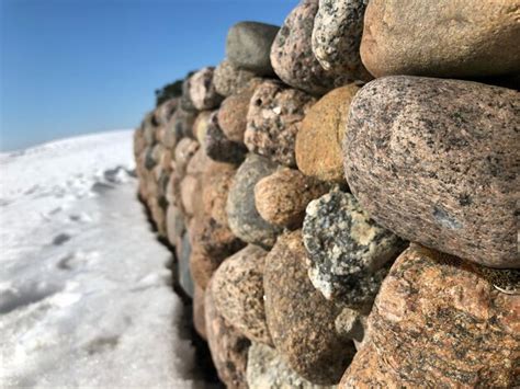 Premium Photo Stack Of Rocks In Sea Against Clear Sky