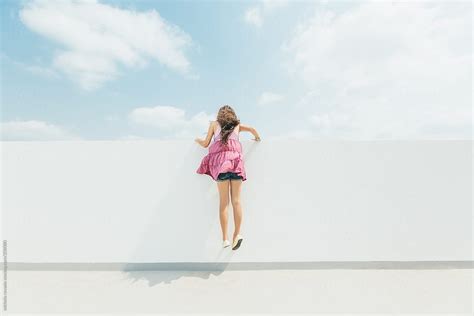 Girl Jumping Back View By Stocksy Contributor Michela Ravasio