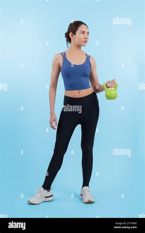 Vigorous Energetic Woman Doing Kettlebell Weight Lifting Exercise On