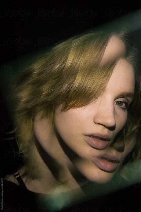 A Portrait Of A Beautiful Woman Distorted And Reflected By A Prism By Stocksy Contributor