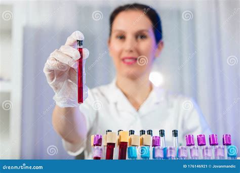 Lab Technician Assistant Analyzing A Blood Sample At Laboratory